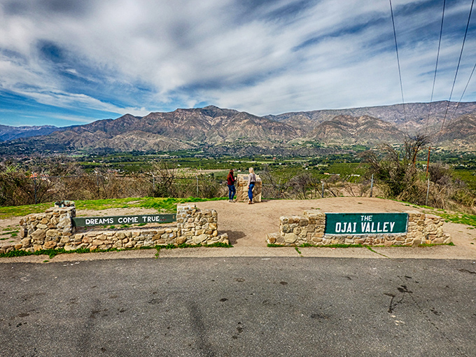 The iconic stone entrance markers frame nature's masterpiece like a living postcard. "Dreams Come True" indeed when gazing across this verdant valley.