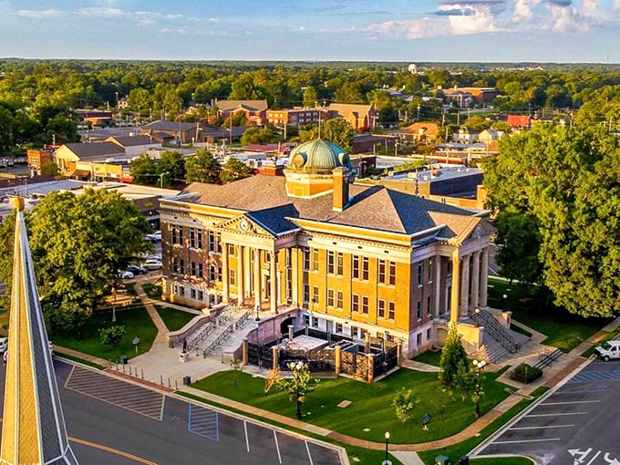 The majestic Limestone County Courthouse stands sentinel over Athens, its copper dome gleaming like a beacon of small-town charm in the afternoon sun.