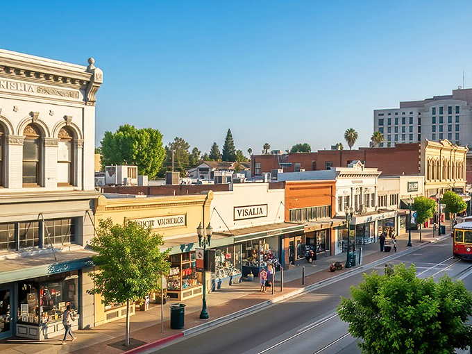 Visalia's downtown skyline basks in golden hour light, with the iconic Fox Theatre marquee standing proud like a sentinel of simpler times. 