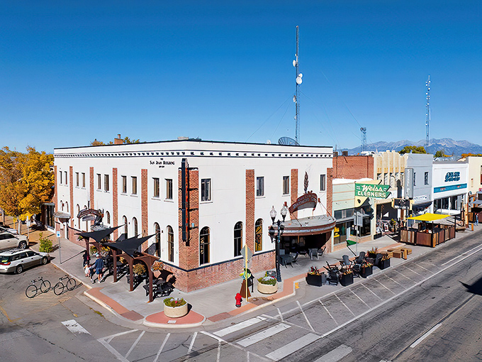 Downtown Alamosa basks in that perfect Colorado sunshine, where historic brick buildings meet mountain views and outdoor dining beckons the hungry traveler.