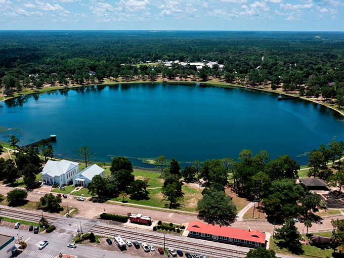 Lake DeFuniak shimmers like a perfect blue coin dropped from heaven, surrounded by a town that time politely decided to leave alone.