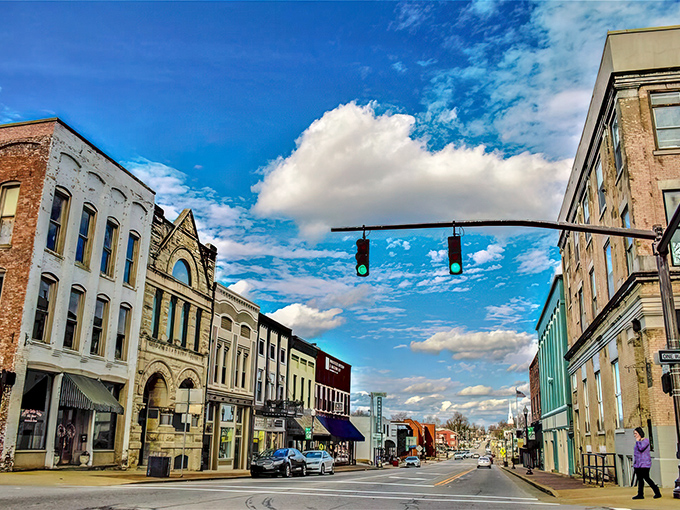 Sunset casts a golden glow on Madisonville's downtown, where the evening rush consists of locals ambling home after a satisfying meal at a family-owned restaurant.