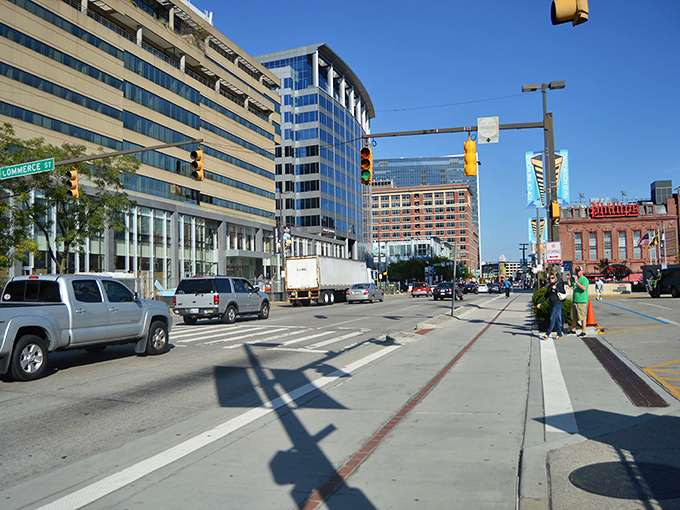 The heart of Baltimore's business district pulses with energy as pedestrians navigate between skyscrapers that seem to be playing a very slow game of Tetris against the sky.