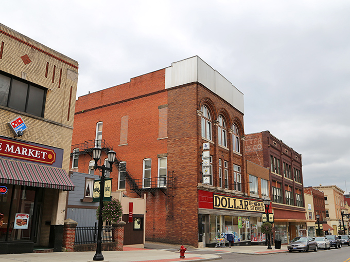 Downtown Cambridge's historic brick buildings stand as colorful sentinels of small-town charm, where affordability meets architectural character on Wheelersburg Street.