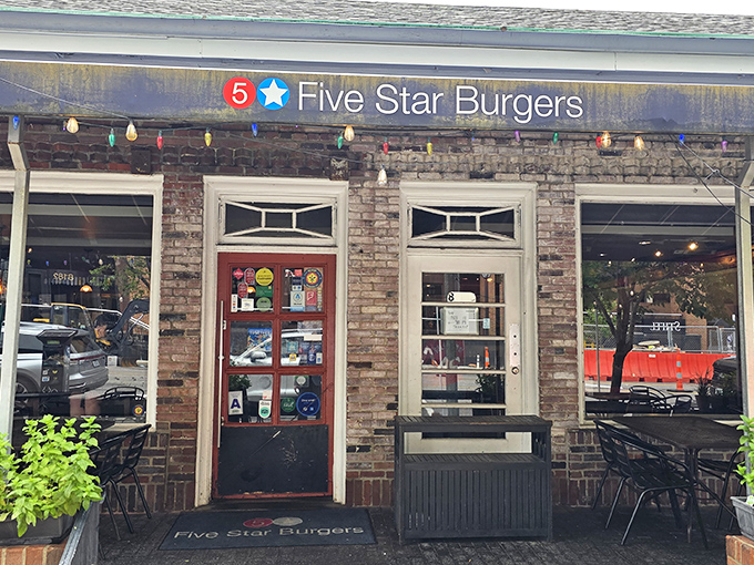 The charming brick exterior of 5 Star Burgers welcomes you with string lights and lush planters&mdash;like that friend whose house always feels more inviting than yours.