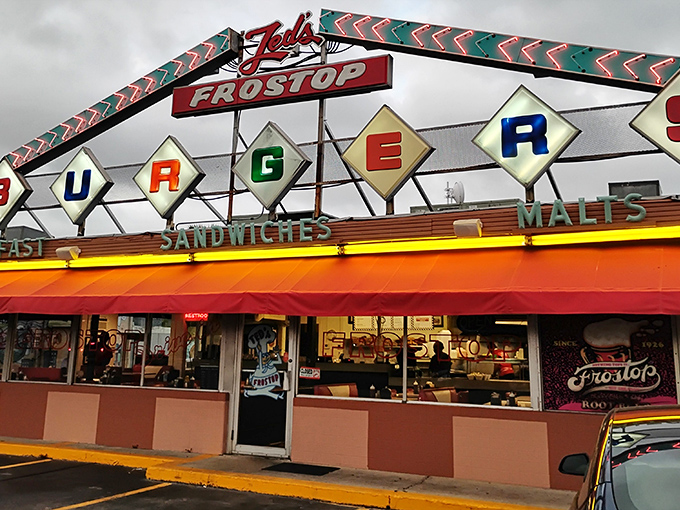 The colorful diamond-shaped "BURGERS" sign promises exactly what you'll find inside: no-nonsense diner perfection that's stood the test of time.