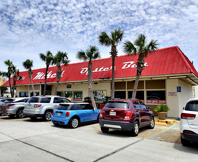 That classic red roof against the Florida sky is like a beacon for seafood lovers—palm trees standing guard over what locals know is culinary treasure.