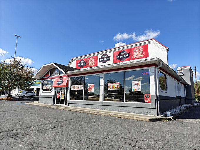 The classic red and white exterior of Fairlane Diner stands like a beacon of hope for hungry travelers. Breakfast paradise awaits inside those doors!