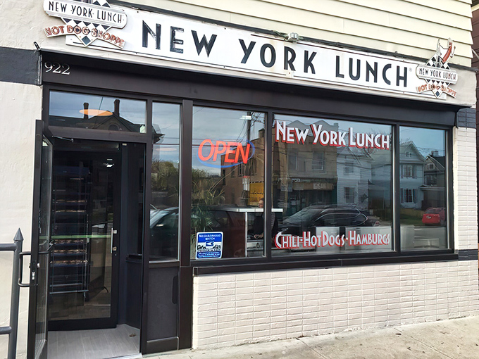 The unassuming storefront of New York Lunch on East Avenue beckons with promises of legendary Greek sauce and diner perfection.