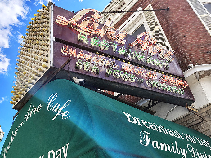 That vintage neon sign says it all &ndash; charcoal steaks, seafood, and chicken. Like a beacon calling hungry travelers home since before Instagram food pics were a thing.