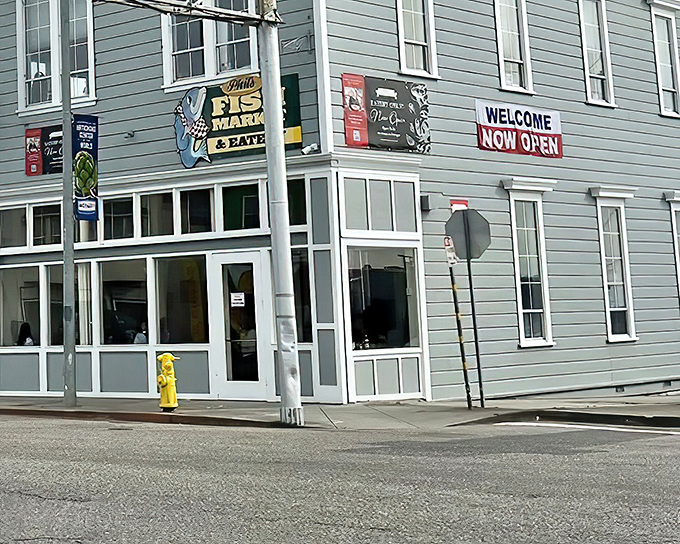 The unassuming exterior of Phil's Fish Market & Eatery belies the seafood treasures within. That cheerful blue fish sign has become a beacon for hungry travelers.