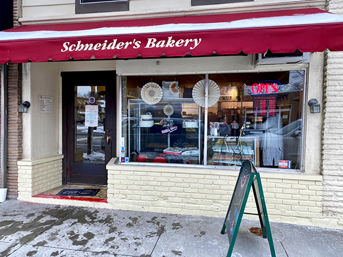 The iconic cream-colored building with red awnings stands like a beacon of baked goodness on Westerville's State Street, promising sweet salvation to early risers.