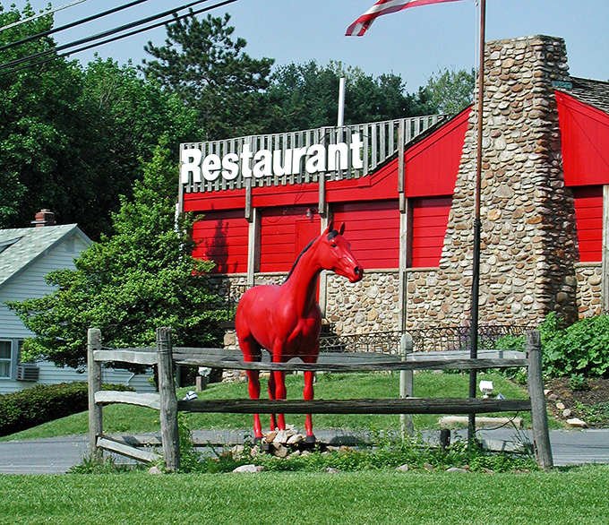You can't miss the life-sized red horse statue standing sentinel outside&mdash;a whimsical guardian that's been directing hungry travelers to steak paradise for generations.