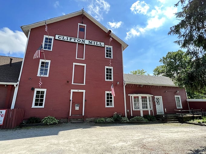 The iconic red exterior of Clifton Mill stands proudly against the Ohio sky, like a Norman Rockwell painting come to life.