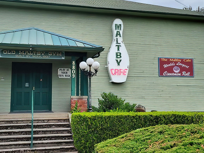 The iconic bowling pin sign beckons hungry travelers like a breakfast lighthouse. This unassuming exterior houses Washington's most legendary morning meal experience.
