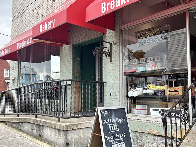 The historic white building with its distinctive blue roof and welcoming porch stands like a culinary lighthouse in Martinsburg, beckoning hungry travelers to dock for breakfast.