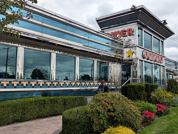 The gleaming chrome exterior of Colony Diner stands like a beacon of breakfast hope on Hempstead Turnpike, promising delicious refuge from hunger pangs.