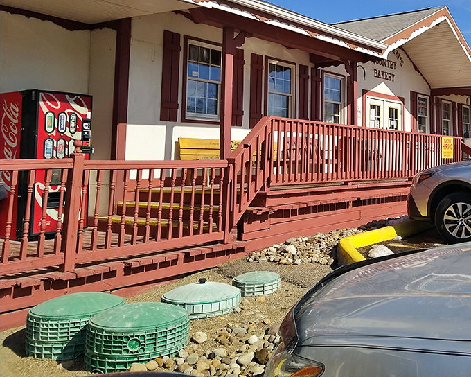 The charming exterior of Kauffman's Country Bakery beckons like a siren song to carb-lovers. That wooden porch has witnessed countless sugar-fueled pilgrimages.