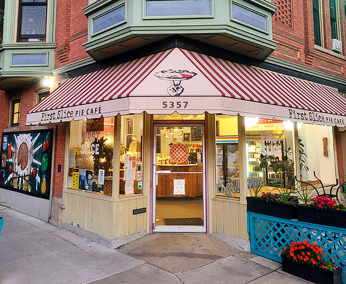 The storefront that launched a thousand cravings. First Slice's cheerful exterior with its vibrant pie mural practically whispers, "Yes, you deserve this today."