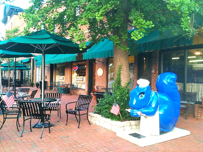 The charming brick exterior of Bluebird Bakery welcomes you with turquoise umbrellas and a whimsical blue squirrel sculpture&mdash;Cincinnati's tastiest woodland creature.