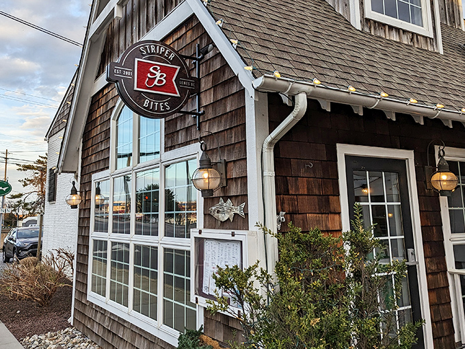 The cedar-shingled charm of Striper Bites beckons like a lighthouse for hungry souls. Those porch lights aren't just decoration&mdash;they're culinary beacons of hope.