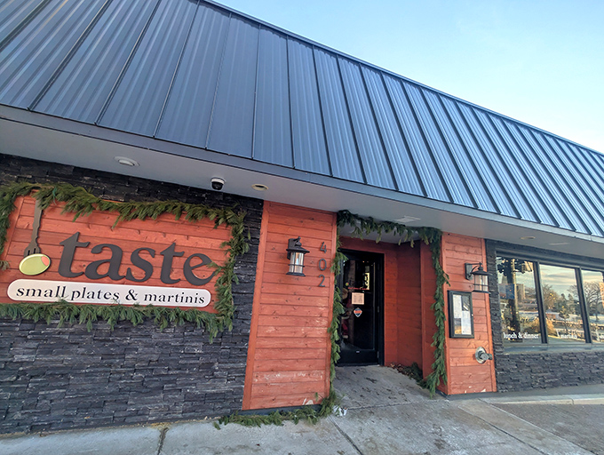 The coral-hued exterior of Taste beckons like a culinary lighthouse on South Haven's shore, promising small plates and big flavors behind its unassuming facade.