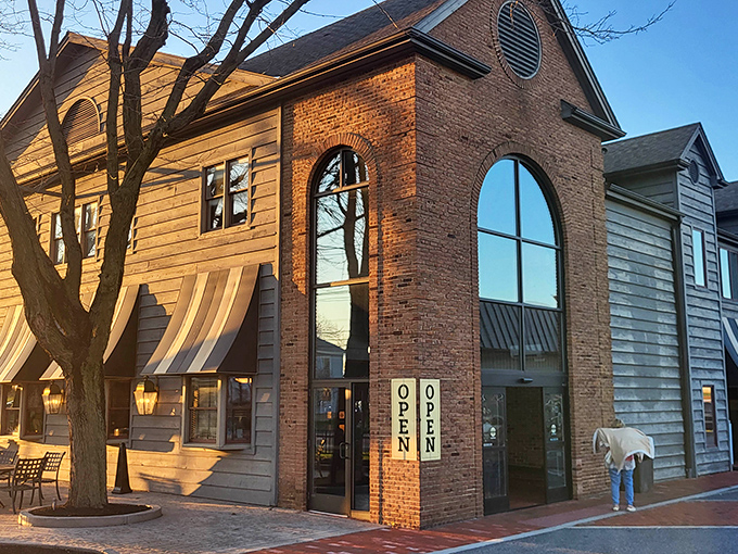 The warm brick and wood exterior of Miller's Smorgasbord beckons like a culinary lighthouse in Amish Country, promising comfort food treasures within.