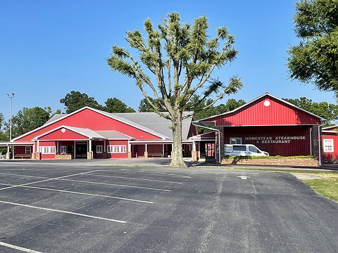 The bright red barn-like exterior of Homestead Steakhouse stands proudly against the Carolina sky, like a beacon calling hungry travelers home.