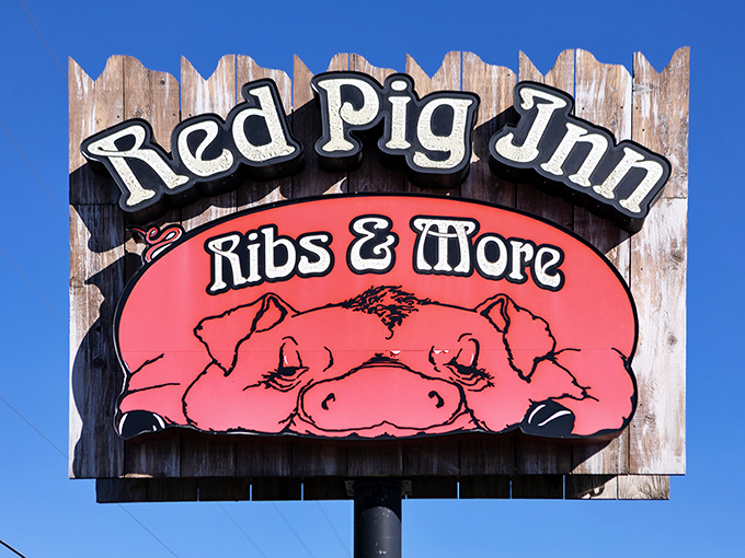 That cheerful pig on the sign knows something you don't: inside awaits barbecue worth celebrating.