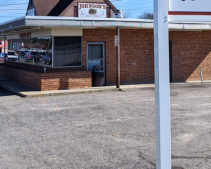 The unassuming brick exterior of Johnson's Drive-In hides a burger paradise that's been drawing crowds since 1946. Some treasures don't need fancy packaging.
