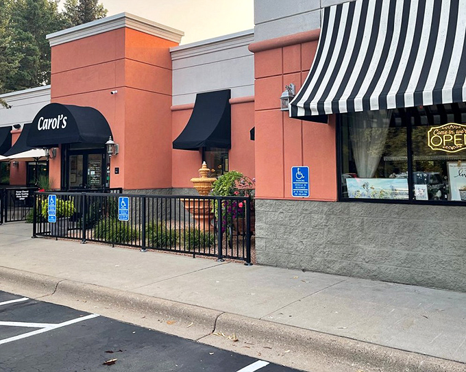 The terracotta-colored exterior of Carol's welcomes you like a warm hug on a cold Minnesota day. Those black awnings aren't just for show&mdash;they're signaling "comfort food ahead."