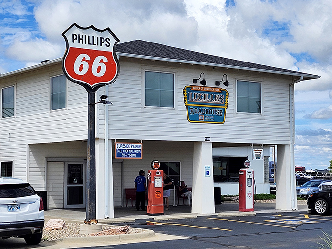 Route 66 nostalgia comes alive at Lucille's Roadhouse, where vintage Phillips 66 signage and classic gas pumps transport you to America's golden age of roadside dining.