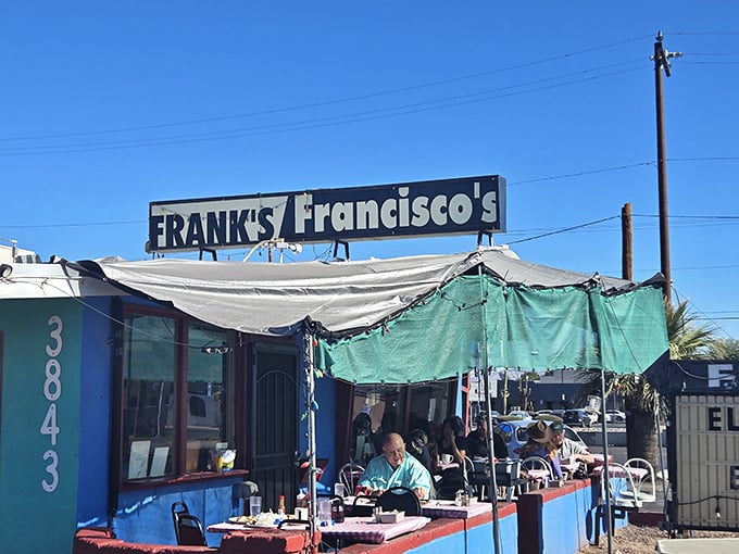 The desert sun sets behind Frank's colorful exterior, transforming this humble Tucson diner into a neon-lit beacon for hungry souls seeking comfort food salvation.