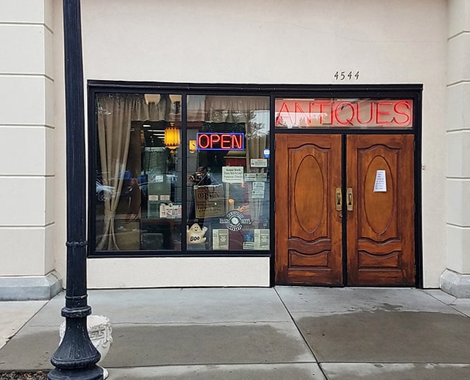 Those magnificent wooden doors aren't just an entrance &ndash; they're a portal to the past. The neon "OPEN" sign beckons treasure hunters inside.