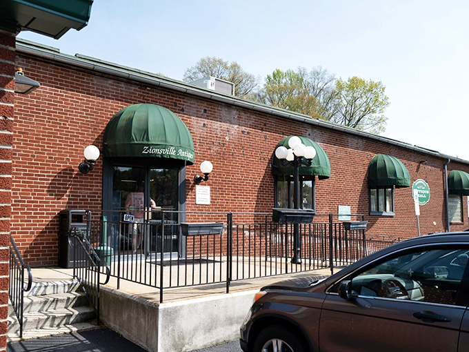 The unassuming brick exterior with classic green awnings &ndash; Pennsylvania's version of a treasure chest disguised as a regular building.