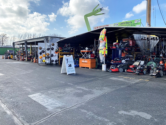 The inflatable green sentinel waves you into a wonderland of lawn equipment and treasures. Weekend warriors, your paradise awaits!