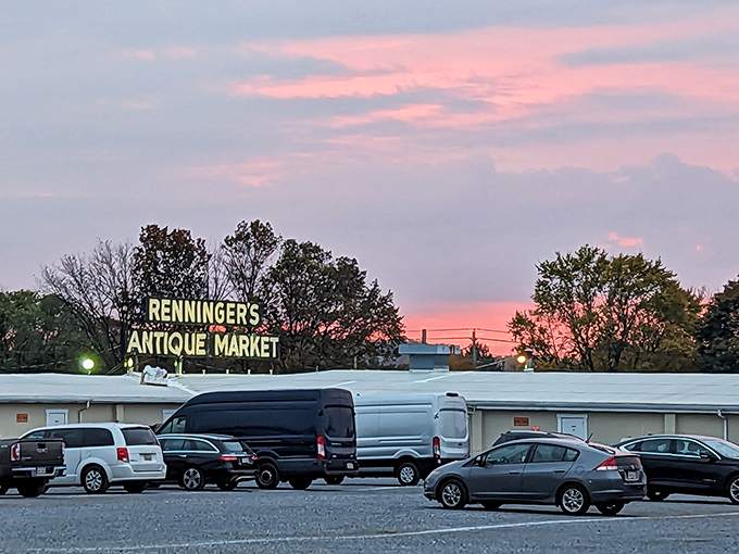 Sunset casts a rosy glow over Renninger's, transforming the market into a silhouette of possibility as vendors pack up their unsold stories.