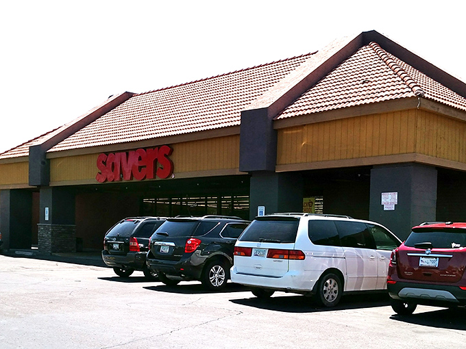 The iconic red Savers sign beckons like a lighthouse to bargain hunters navigating the sea of retail markup on West Bell Road.