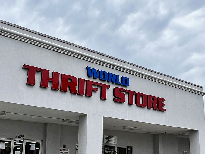 The iconic red and blue signage of World Thrift stands like a beacon for bargain hunters against the Florida sky, promising treasures within.
