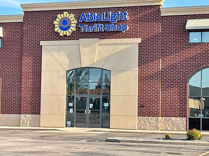 The sunshine-bright logo of AbleLight Thrift Shop beckons bargain hunters like a retail lighthouse on Appleton's shopping landscape.
