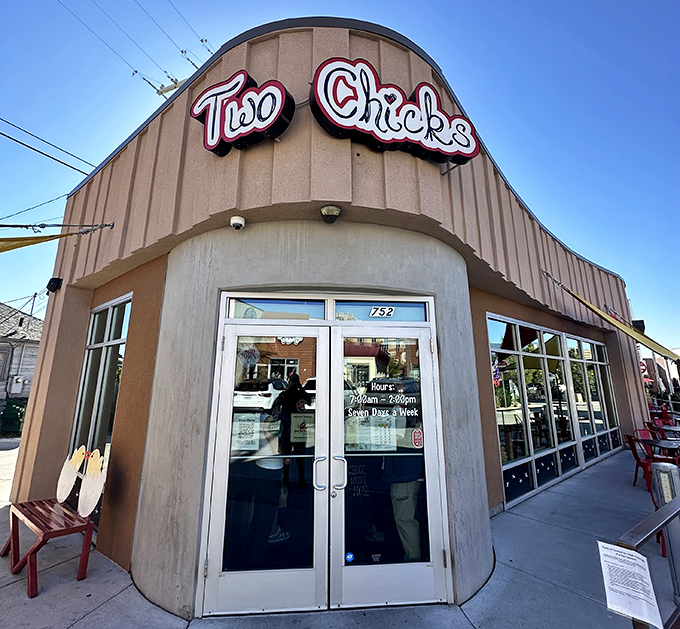 The curved entrance of Two Chicks welcomes hungry patrons like a breakfast beacon in Reno's Midtown district.