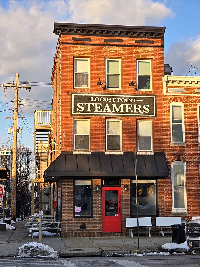 The iconic brick exterior of L.P. Steamers stands like a lighthouse for hungry seafood lovers, its vintage signage a beacon in Baltimore's Locust Point neighborhood.