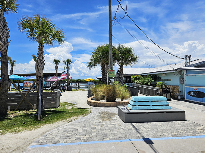 Palm trees, blue skies, and outdoor seating that whispers, "Your office called. I told them you moved to Florida permanently."