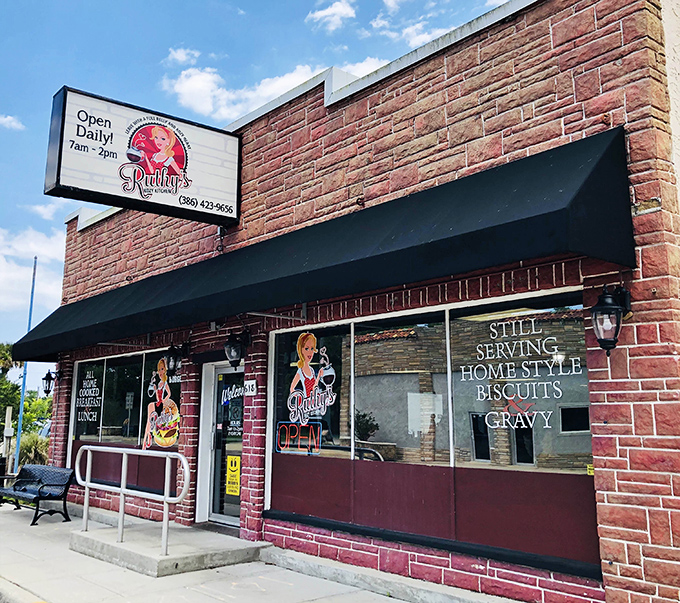 The brick facade and blue awning of Ruthy's Kozy Kitchen stand as a beacon for breakfast lovers in New Smyrna Beach. Morning sunshine included at no extra charge!