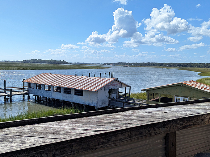 Paradise found! This weathered dock house perched over the marshlands isn't just a restaurant—it's a South Carolina institution where time slows down and appetites come alive.