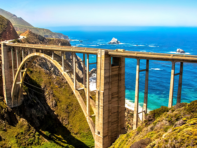 Bixby Creek Bridge stands like a concrete rainbow against the azure Pacific, where engineering brilliance meets nature's grandeur in perfect harmony.