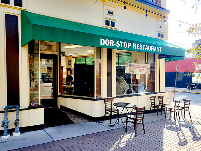 The iconic green awning of Dor-Stop Restaurant beckons hungry Pittsburghers like a breakfast lighthouse guiding ships to shore.
