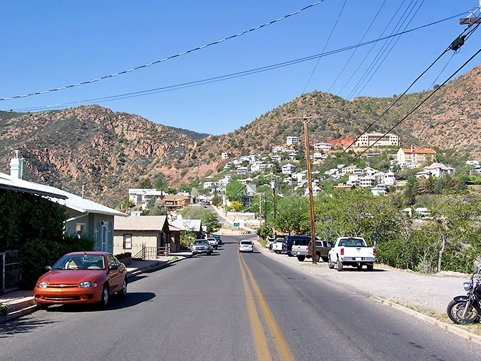 Jerome's winding roads and hillside homes create a living postcard, where every turn reveals another slice of Arizona history against rugged mountain backdrops.
