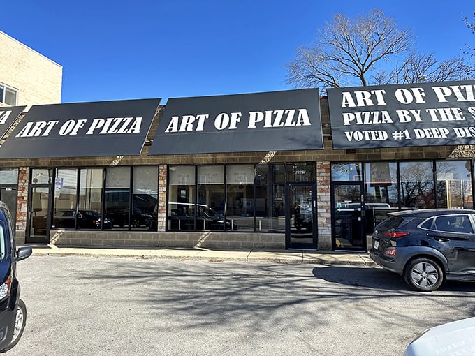 The unassuming storefront of The Art of Pizza, where culinary masterpieces hide behind a modest brick fa&ccedil;ade. Chicago's best-kept secret in plain sight.