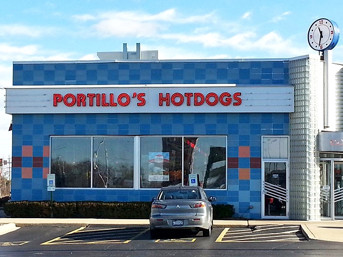 The iconic blue-checkered exterior of Portillo's in Villa Park stands like a beacon of hope for the hungry traveler. Chicago food culture in architectural form.